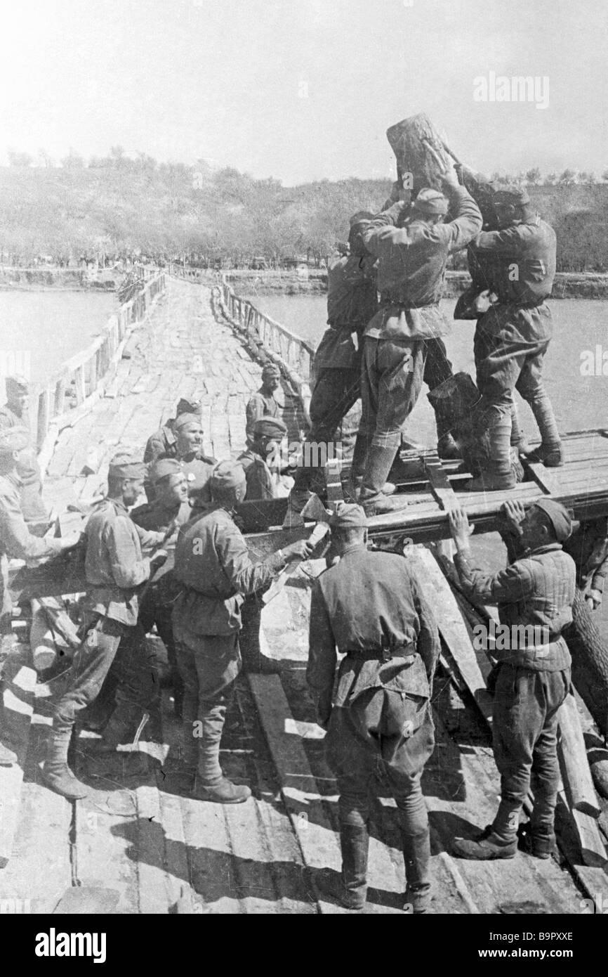 Soviet combat engineers building a bridge across the Danube River The ... Soviet combat engineers building a bridge across the Danube River The ...