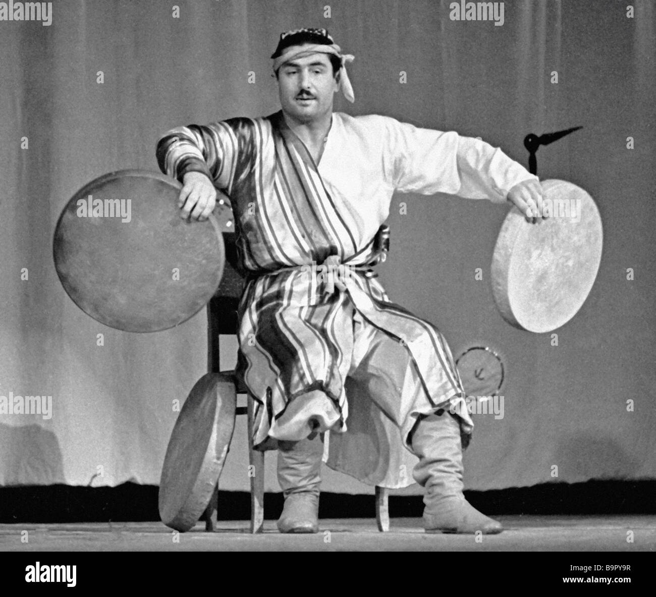 International prize holder Allo Alaev playing folk instruments Stock ...