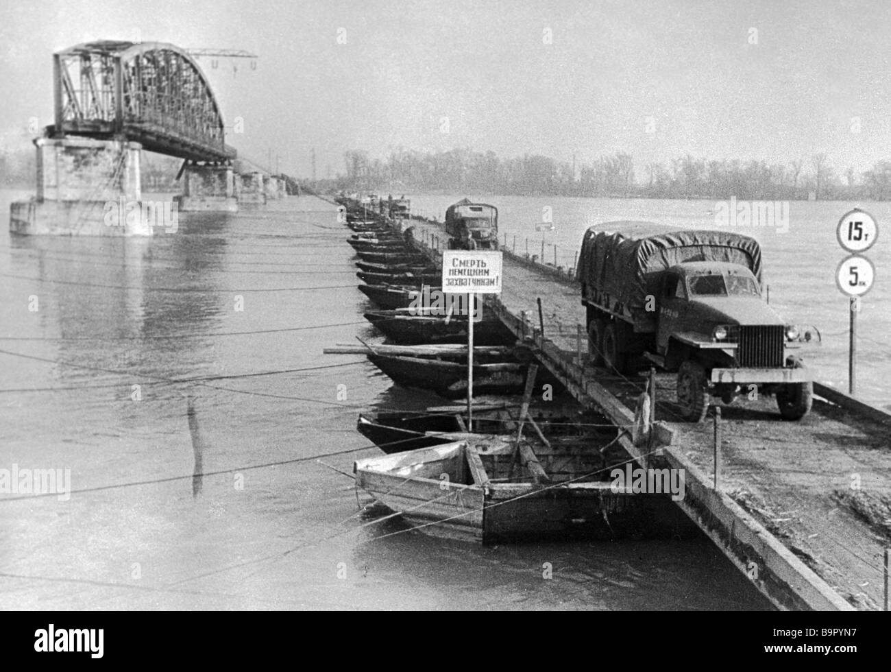 Soviet troops crossing the Danube River on the provisional bridge ...