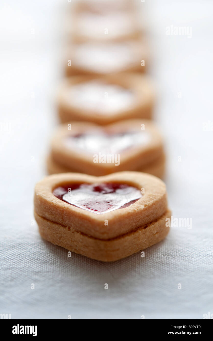 Row of heart shaped jam tarts Stock Photo - Alamy