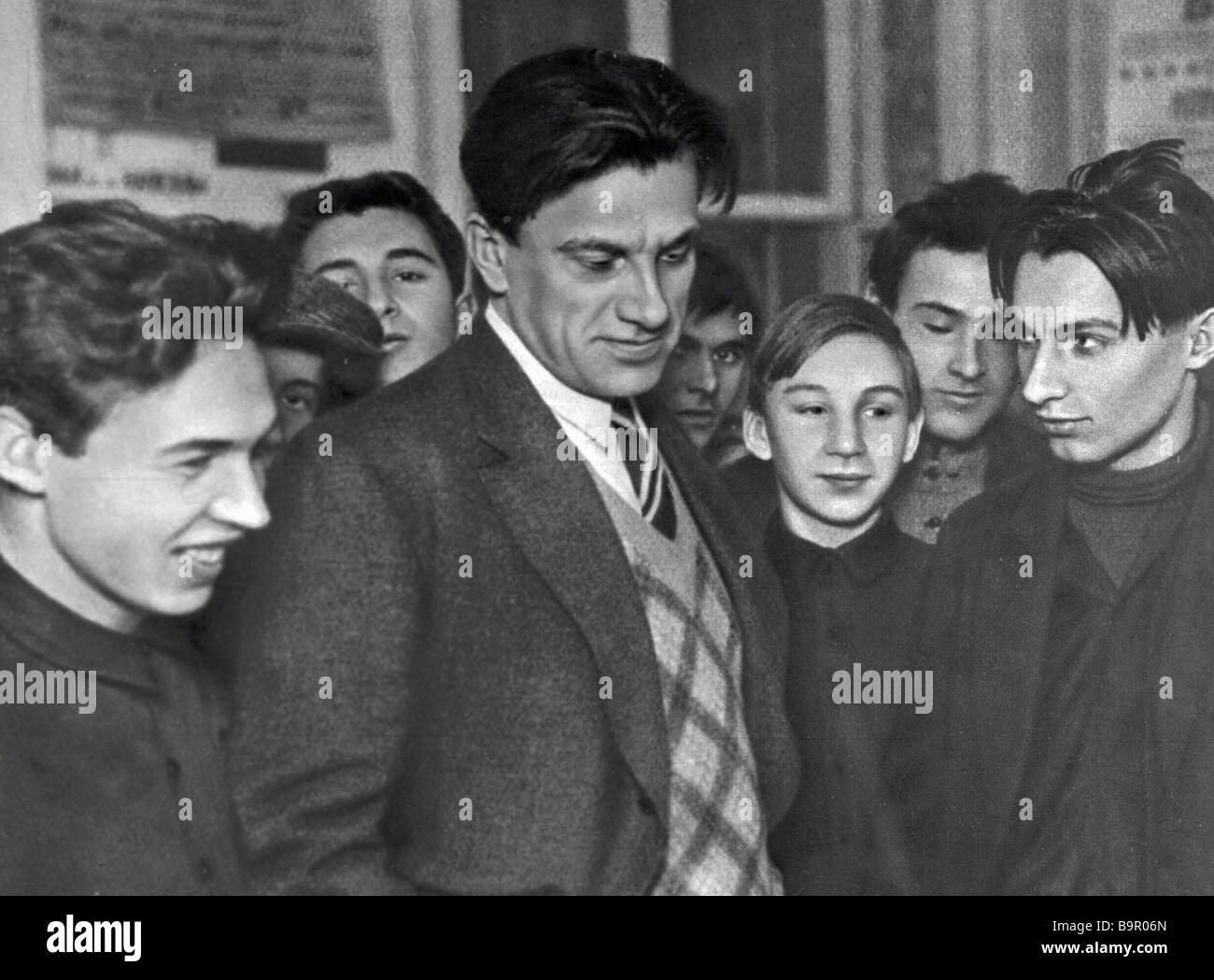 Soviet poet Vladimir Mayakovsky second from left among young people at ...