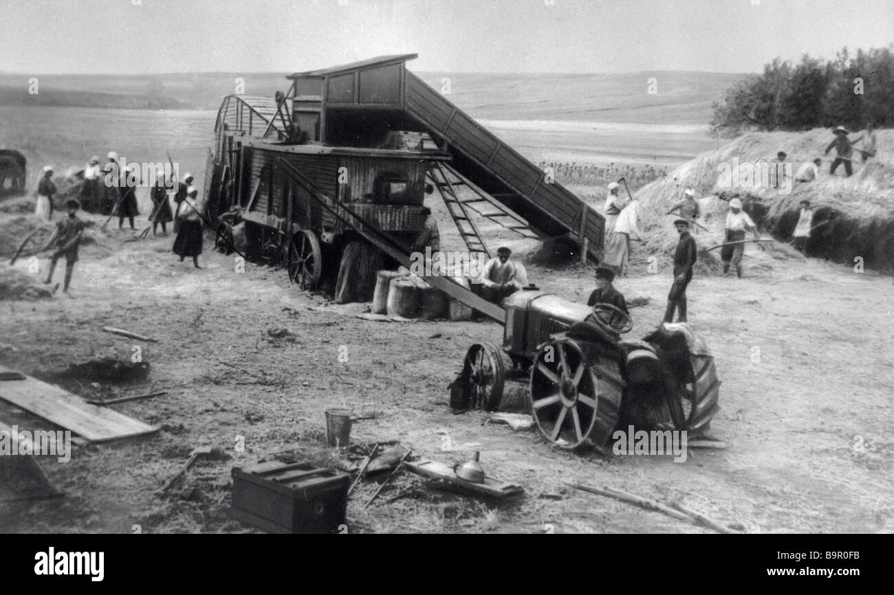 Threshing grain at Mayak Kommunizma Beacon of Communism collective farm ...