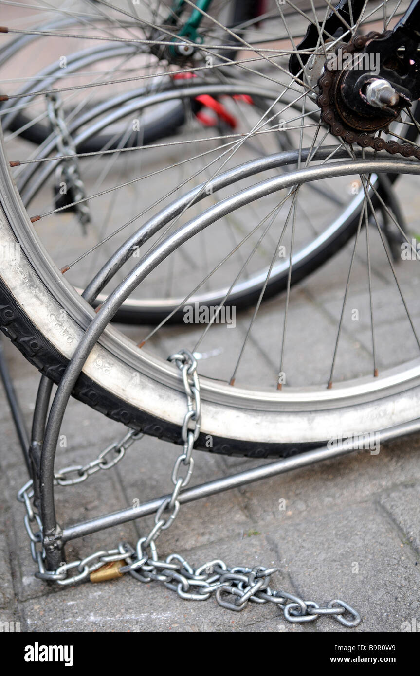 bicycle chained in the street Stock Photo - Alamy