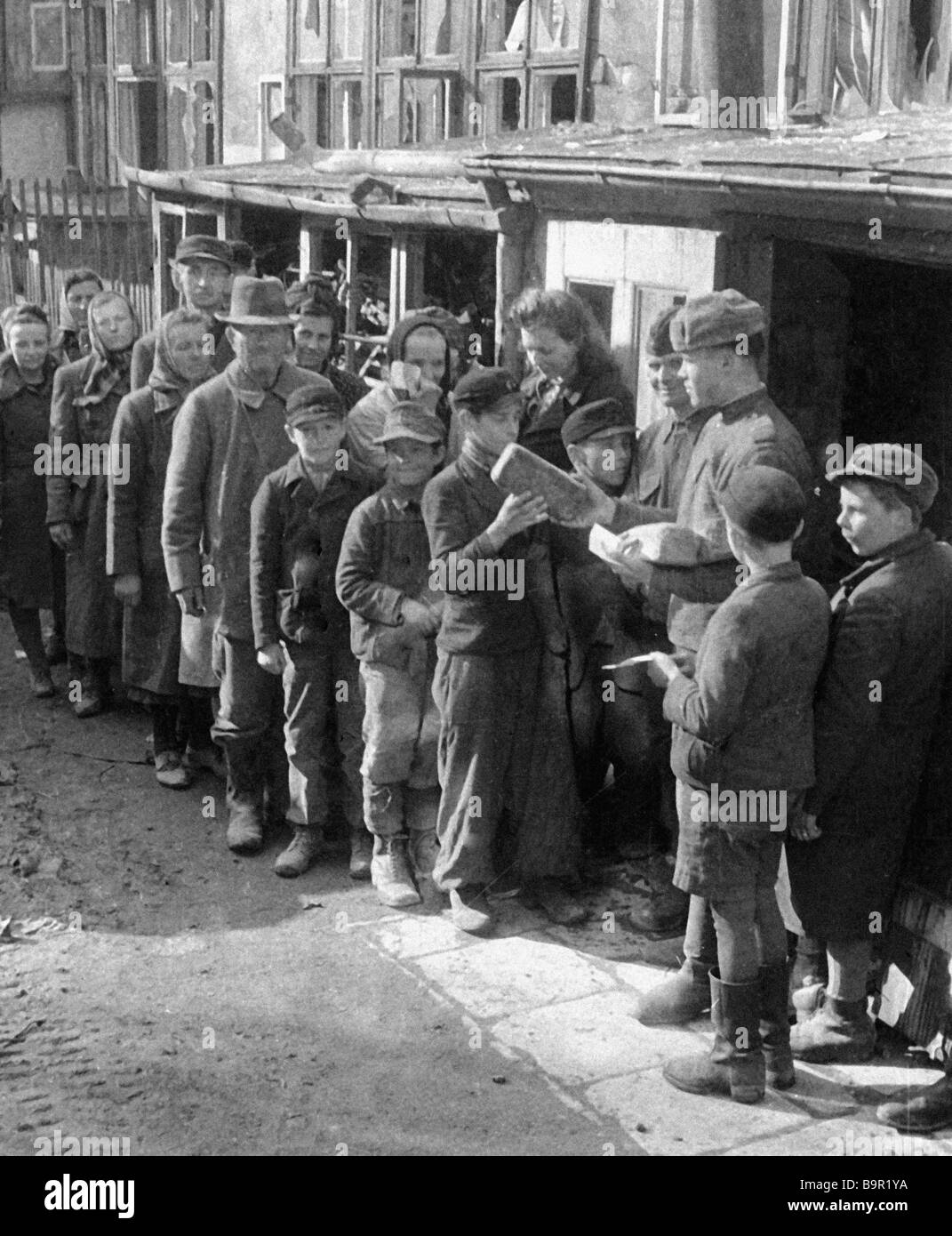 Soviet troops rationing off bread for the people of Wroclaw Breslau ...