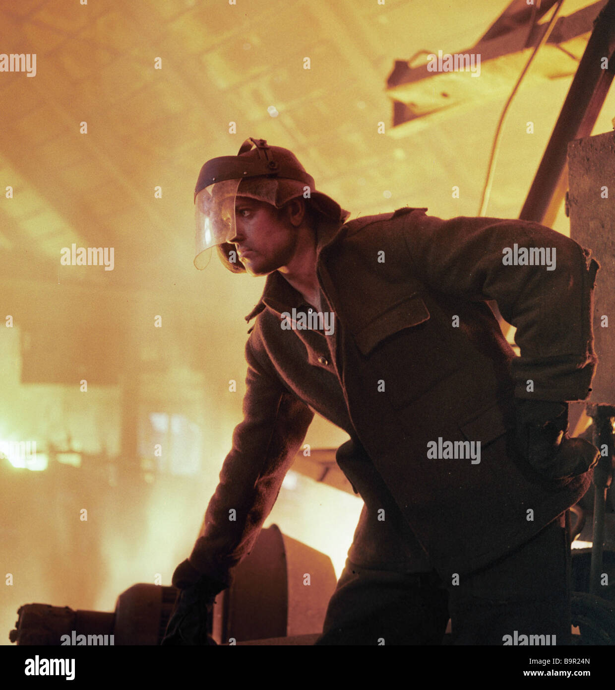 Senior fore hearth operator controls steel smelting process inside ...