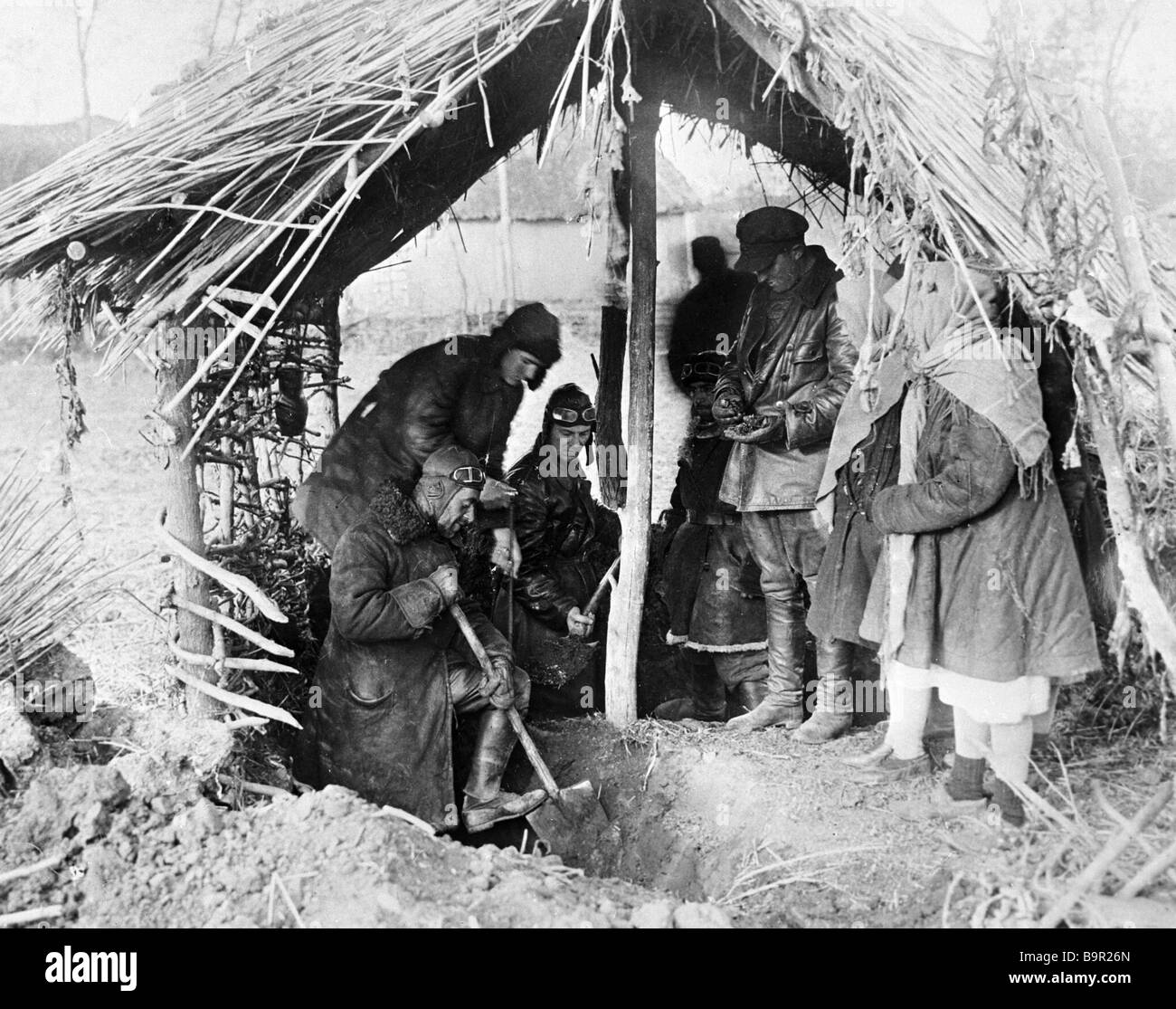 Kurgan region collective farmers opening up a store of rotten wheat ...