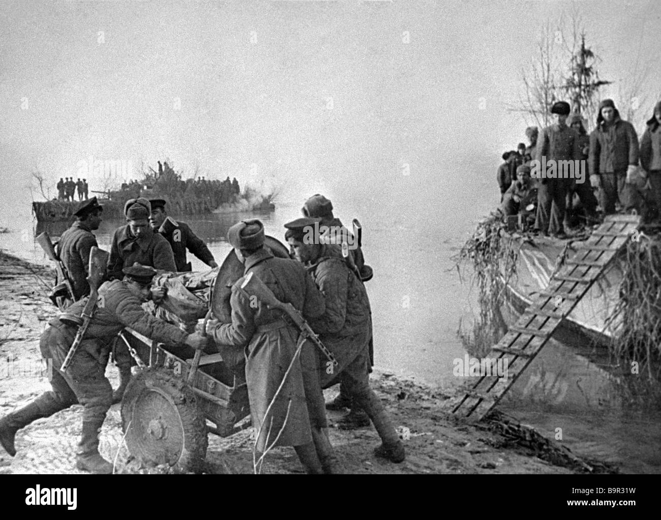 Soviet troopers going aboard a cutter to cross the Danube River Stock ...