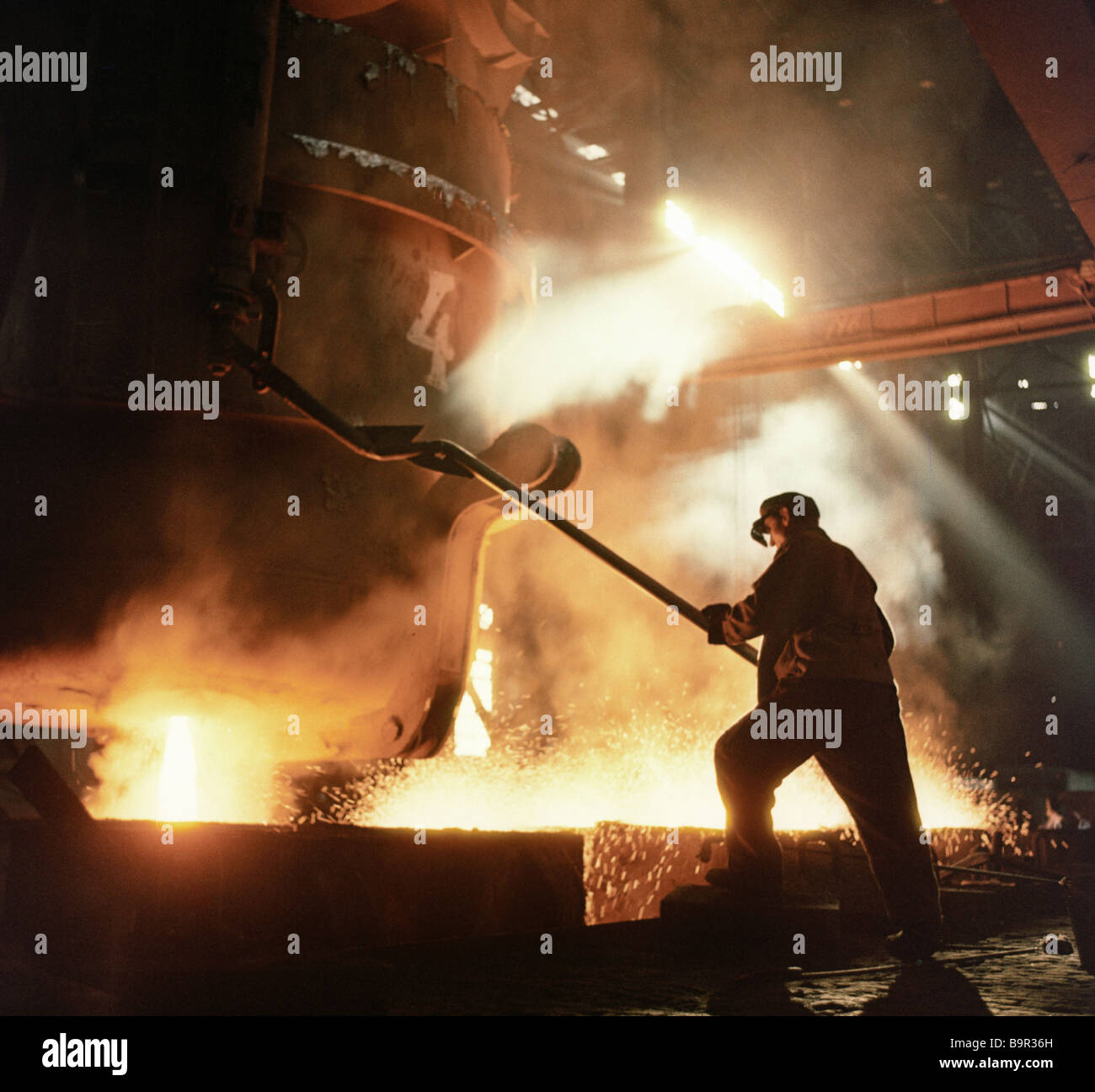 Pouring out steel at converter workshop of Lenin iron and steel works ...