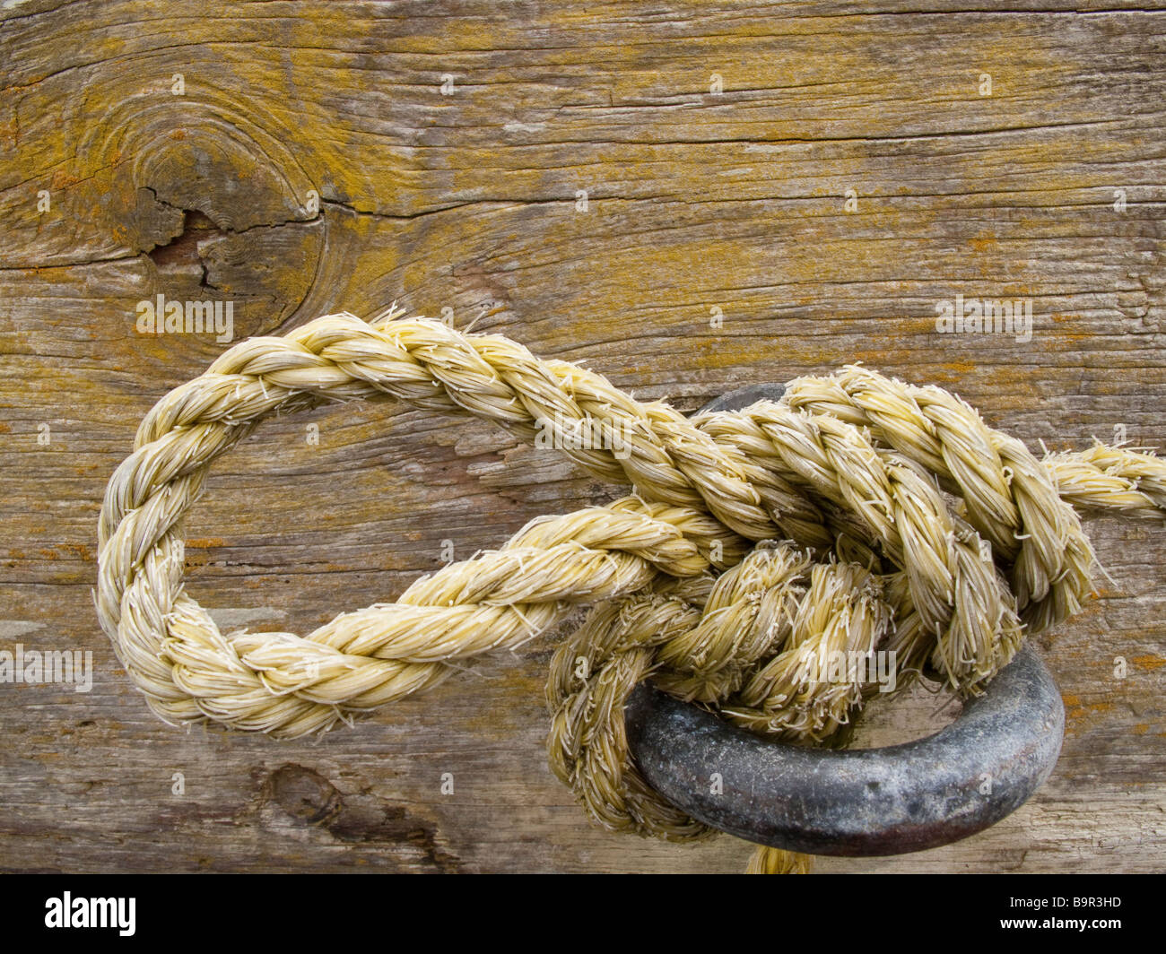 Rope tied around a ring Stock Photo - Alamy