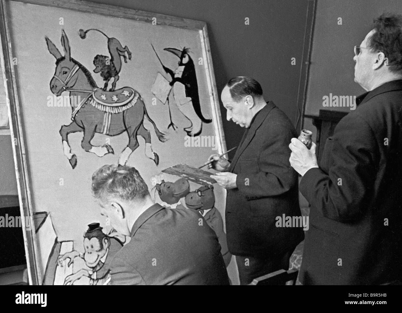 The Kukryniksy artists paint a decorative panel on the themes of Samuel ...