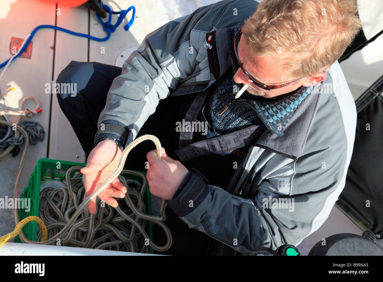 man checking anchor system Stock Photo - Alamy