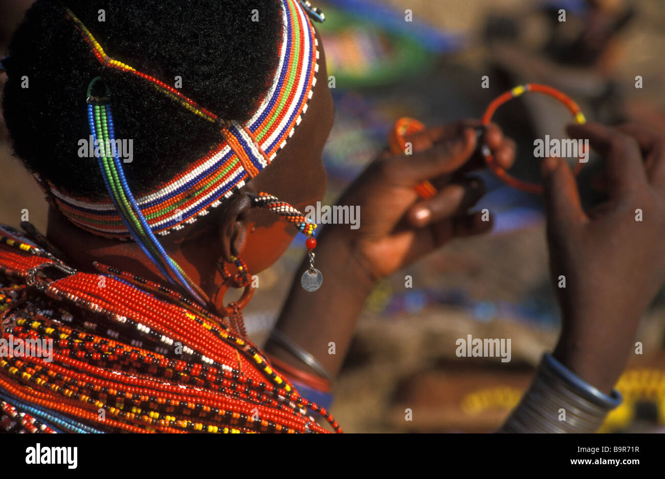 Woman doing beadwork hi-res stock photography and images - Alamy