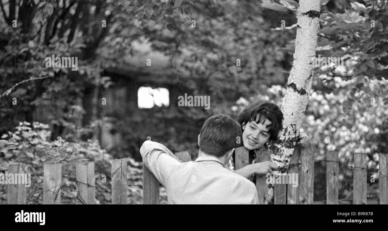Young people chatting beside the gate Stock Photo - Alamy