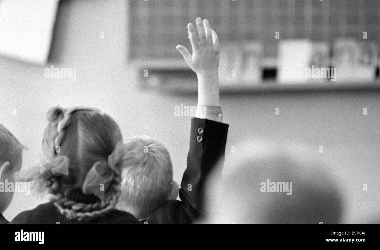 A first former raised his hand to answer the question at the lesson ...