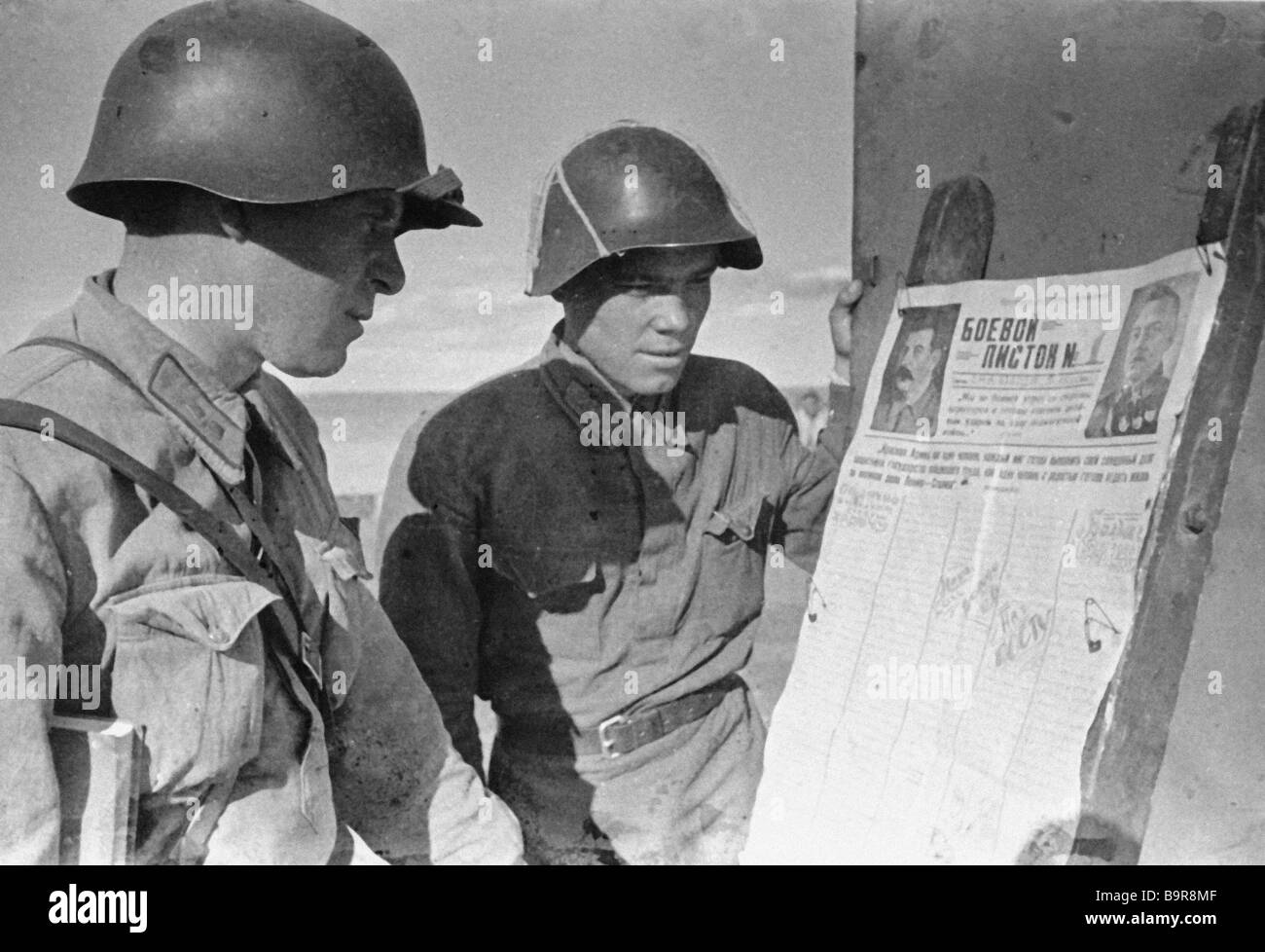 Soviet soldiers read the Combat Leaflet between the battles of Khalkhin ...
