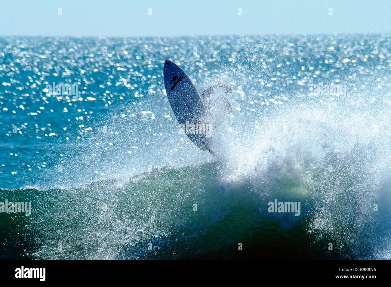 Surfer, board and ocean spray www.lookinglost.com Stock Photo - Alamy