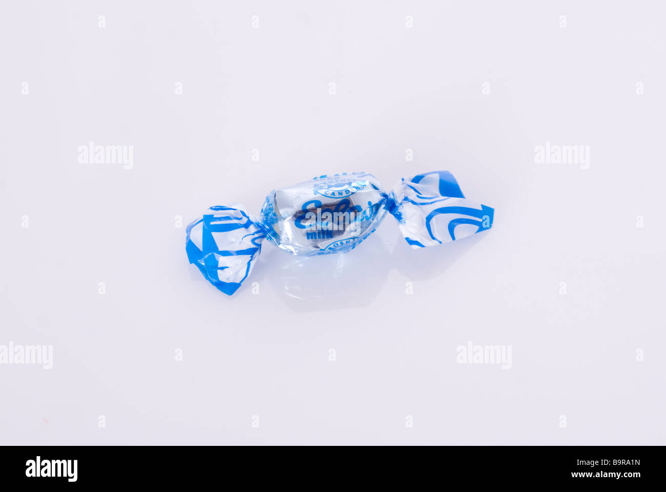 wrapped candy sweets on a white background Stock Photo - Alamy