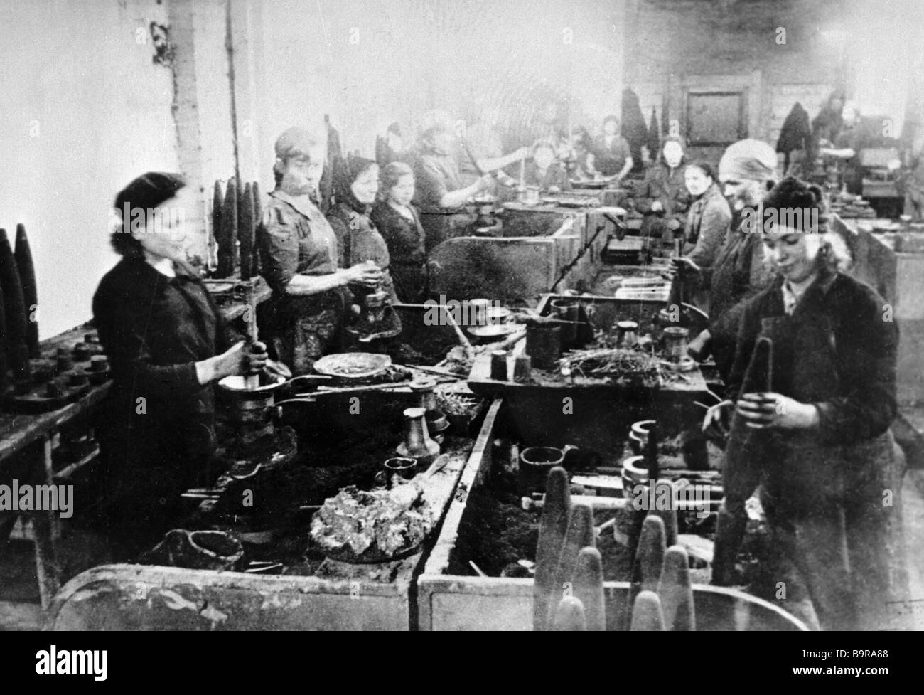 Female workers make artillery shells in a Leningrad factory Stock Photo ...
