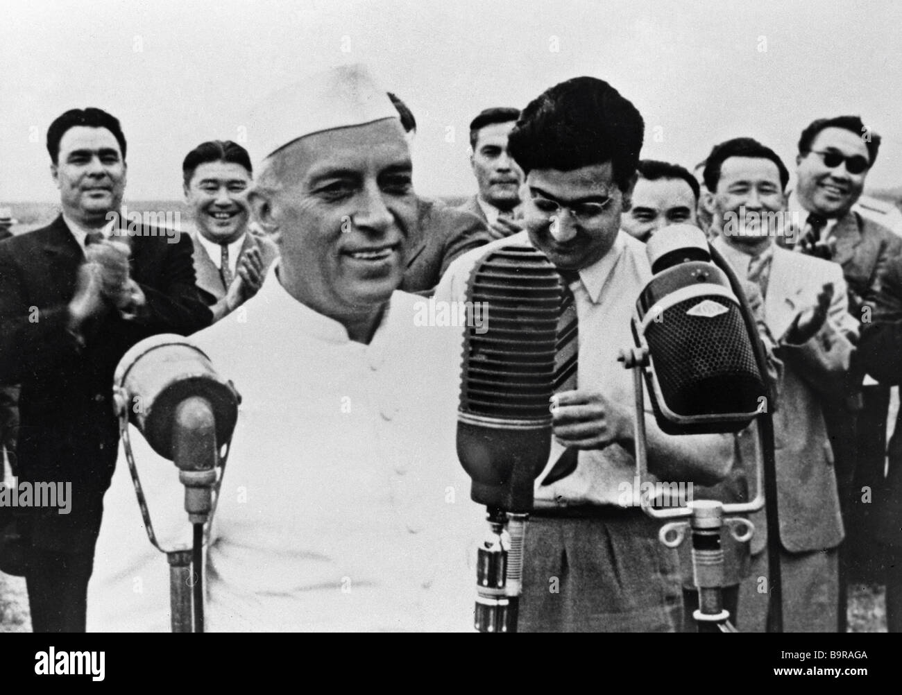Indian Prime Minister Jawaharlal Nehru left foreground being met by ...