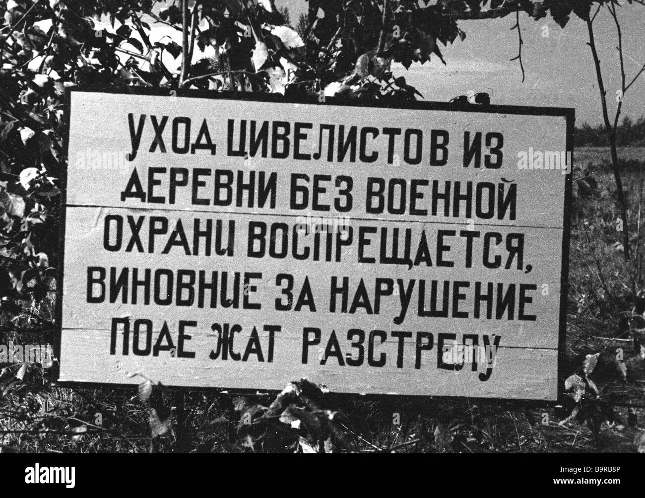 SS units hang such signs in captured towns and villages threatening ...