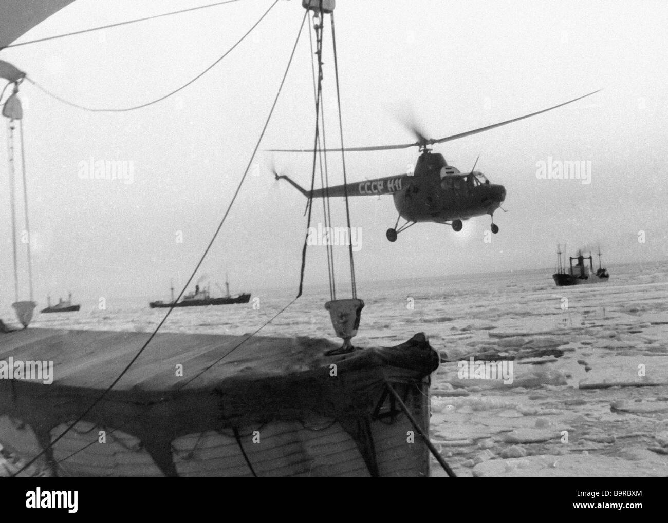 Helicopter taking off from the Yermak icebreaker to study the ice in ...