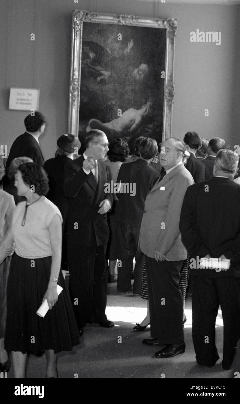 Visitors admire painting The Sacrifice of Abraham at an exhibition of ...