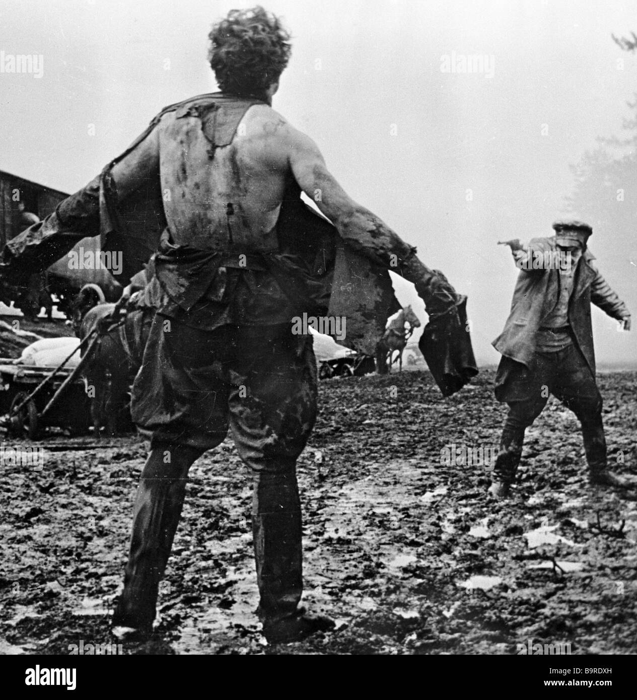 Actor Yevgeny Urbansky with his back turned as Gubanov in the film ...