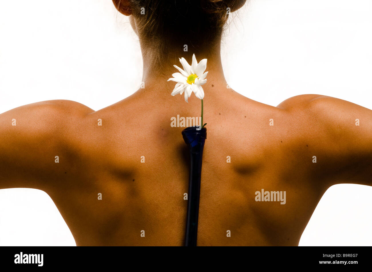 Woman´s back with white flower Stock Photo - Alamy