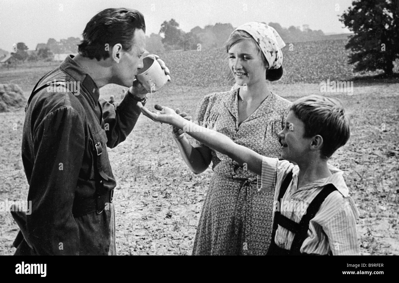 Igor Ozerov as Father Zinaida Kiriyenko as Mother and Lyosha Zharikov as Kolya right in film ...