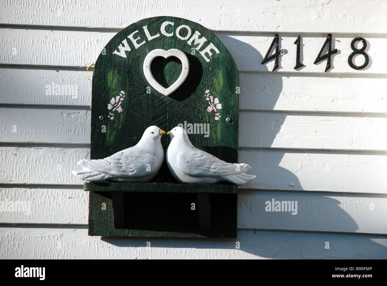 Welcome sign with doves Stock Photo - Alamy