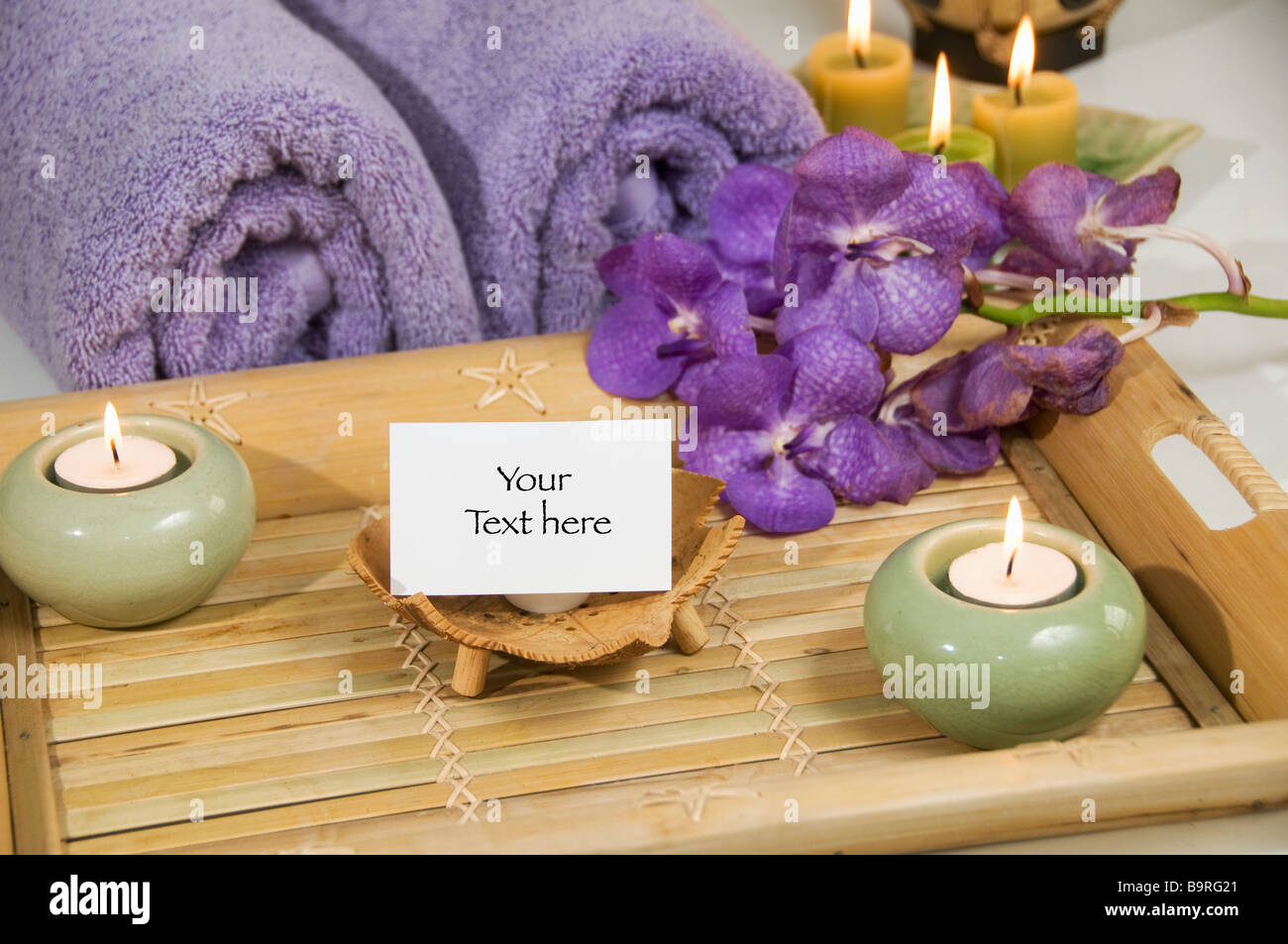aromatherapy candles and oil with bath towels at spa Stock Photo - Alamy