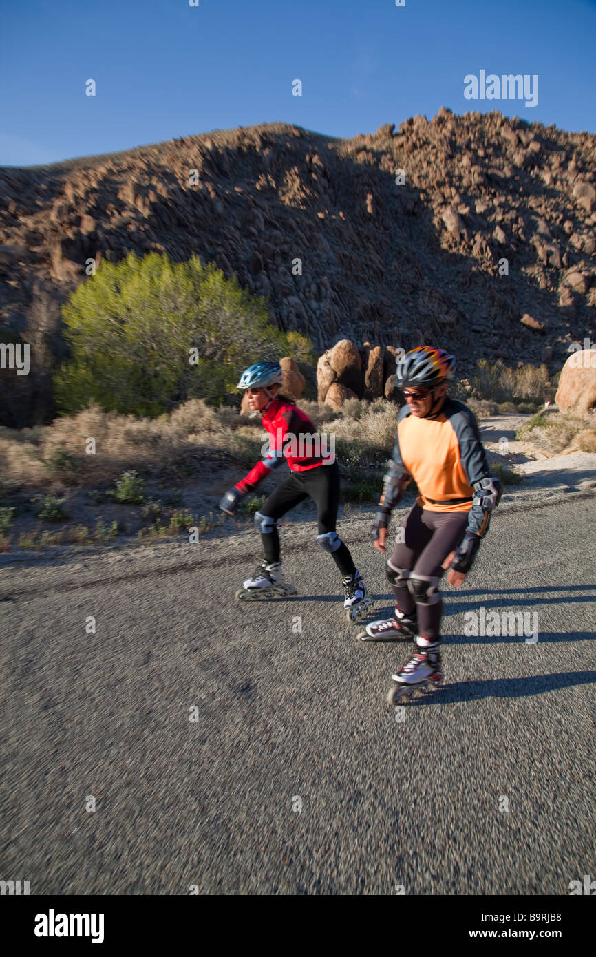 Couple roller blading Stock Photo - Alamy