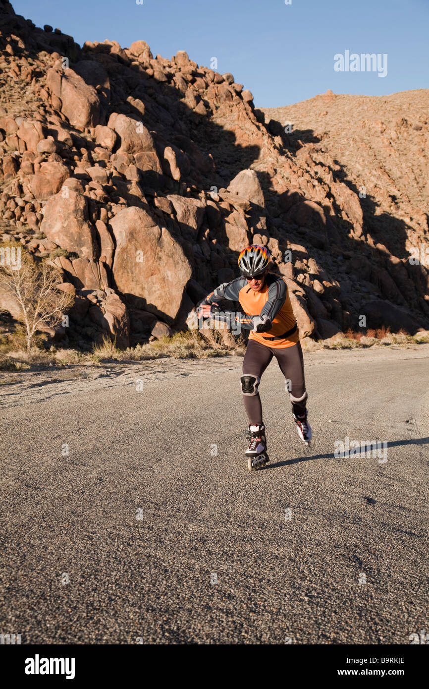 Man skating through rocks Stock Photo - Alamy