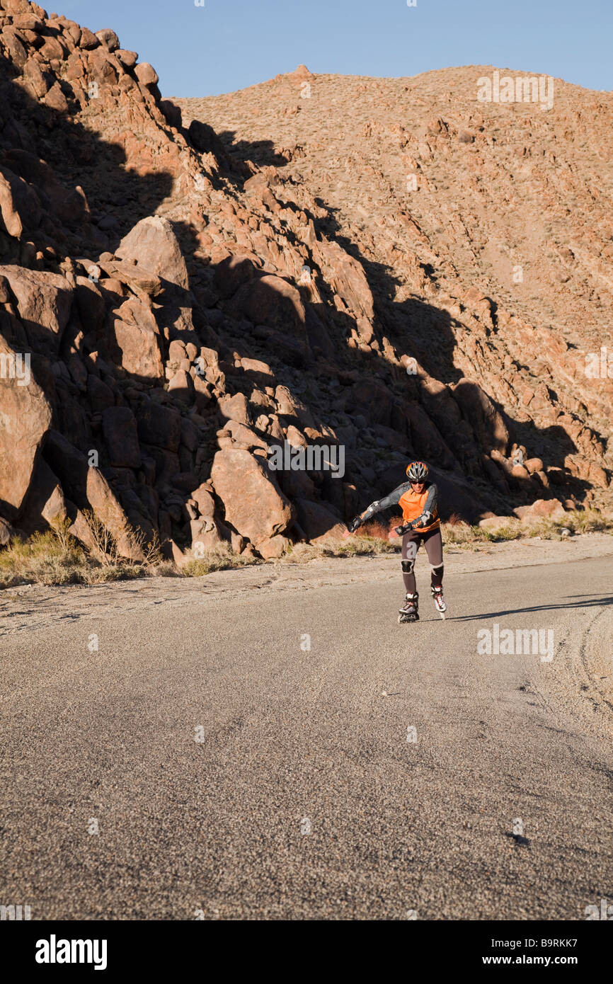 Man skating through rocks Stock Photo - Alamy