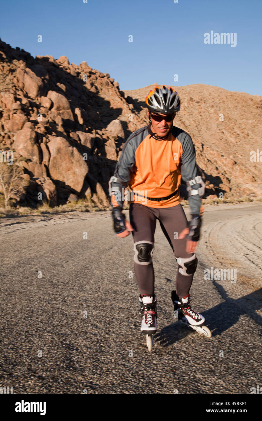 Man skating through rocks Stock Photo - Alamy