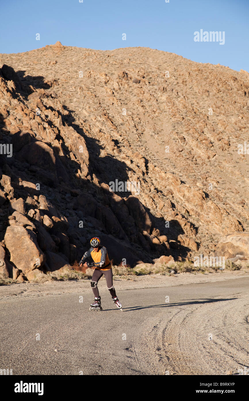 Man skating through rocks Stock Photo - Alamy