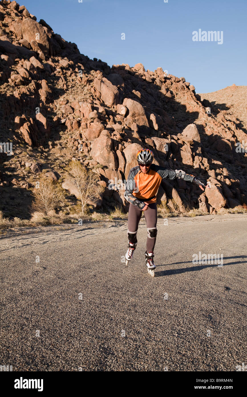 Man skating through rocks Stock Photo - Alamy