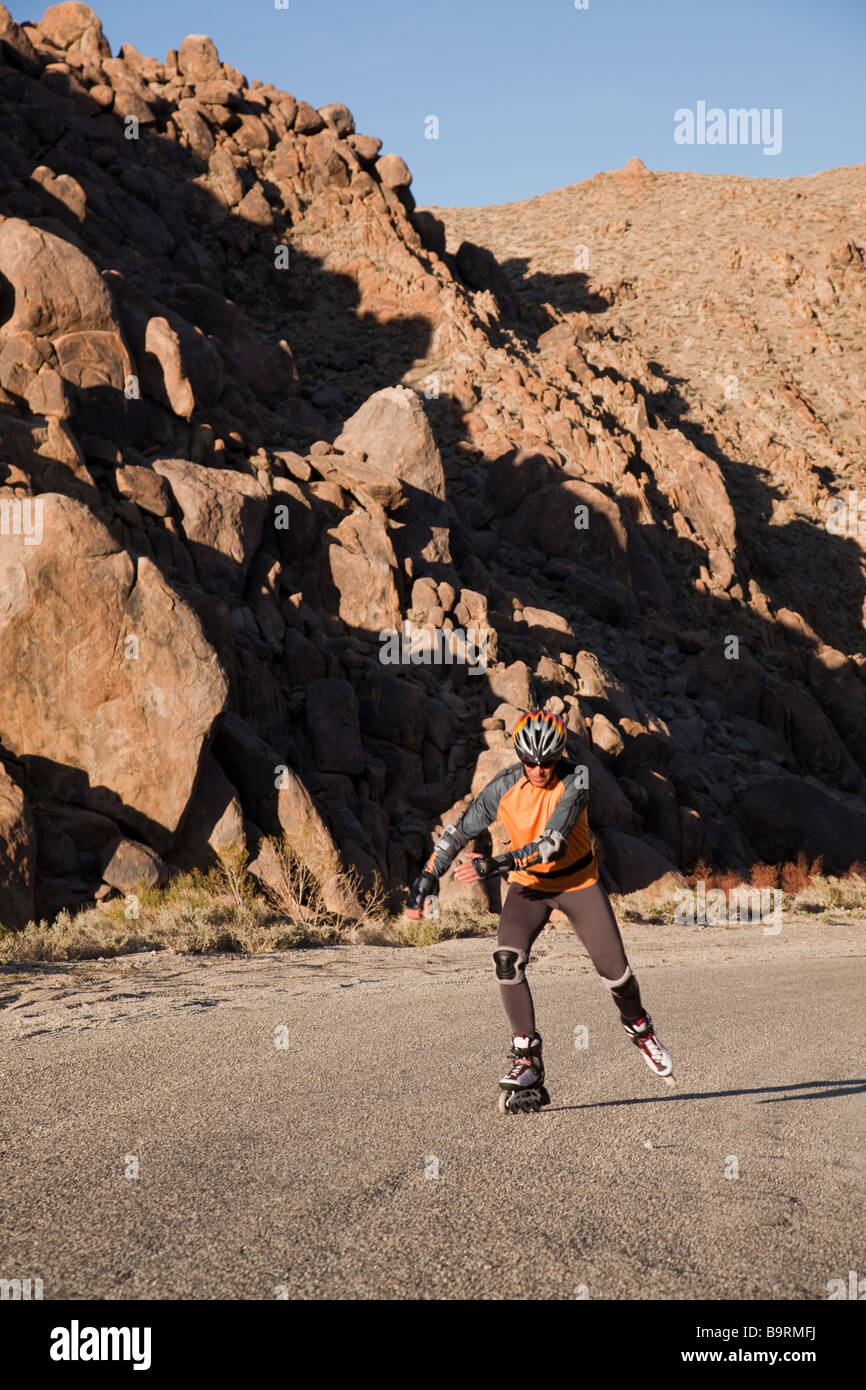 Man skating through rocks Stock Photo - Alamy