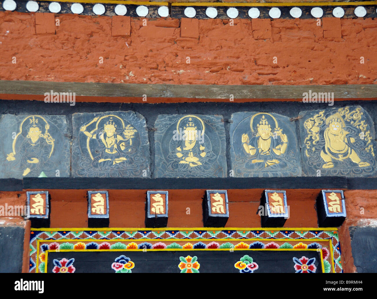 A building decorated in traditional Bhutanese fashion with painted beam ...