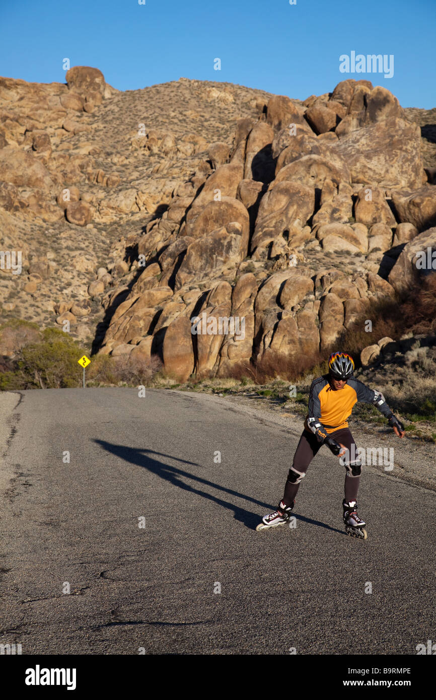 Man skating through rocks Stock Photo - Alamy
