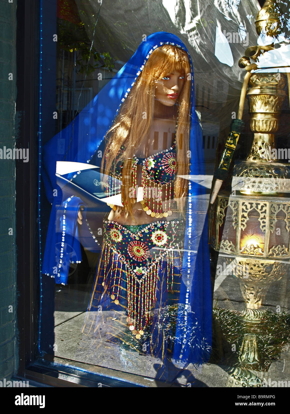 Greek belly dancer dummy in costume in restuarant window with ...