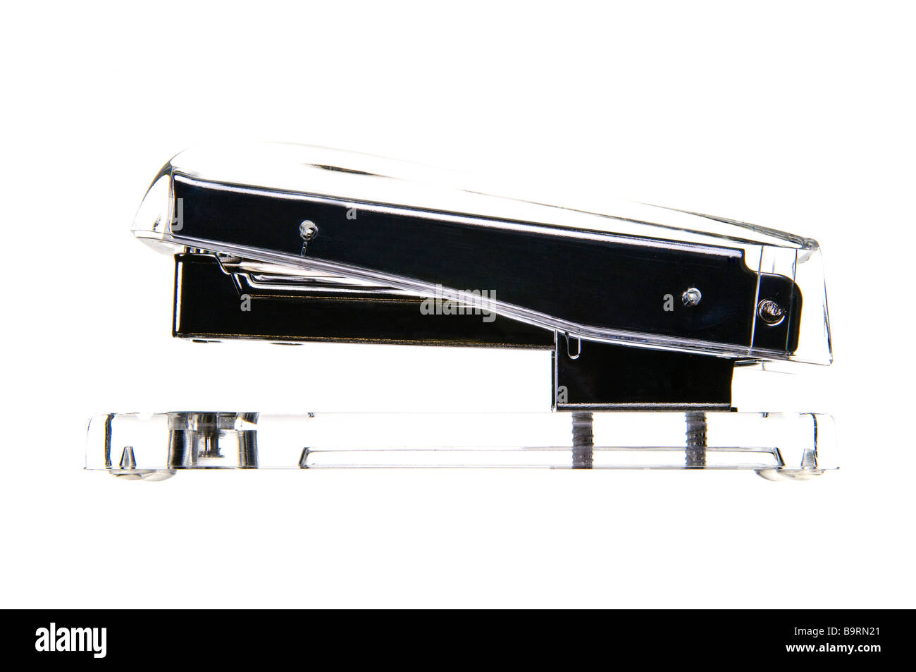 See through view of a clear plastic stapler against a white background ...