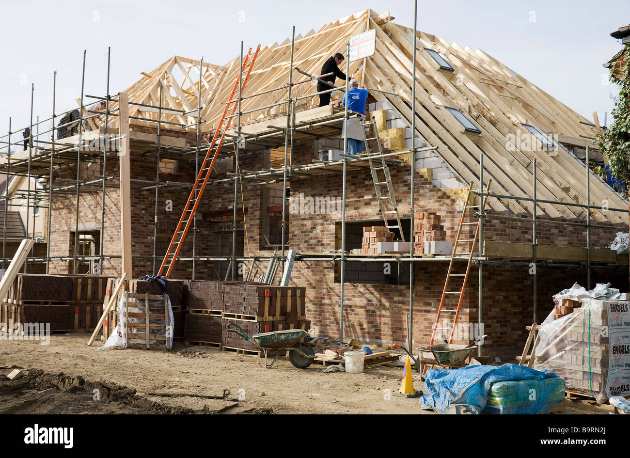 Building site of a new house in the process of having the roof ...