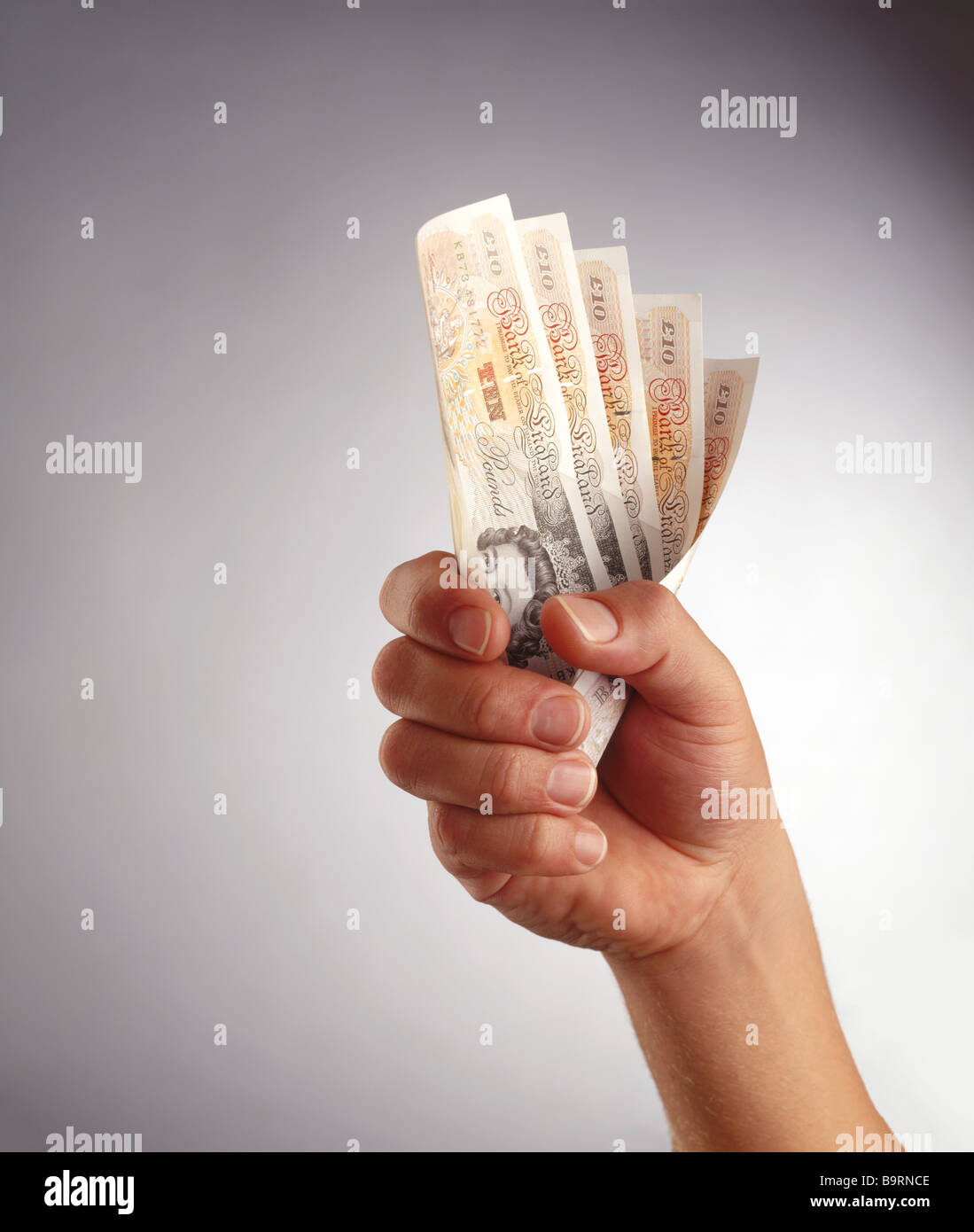 Fist full of tenners Stock Photo - Alamy