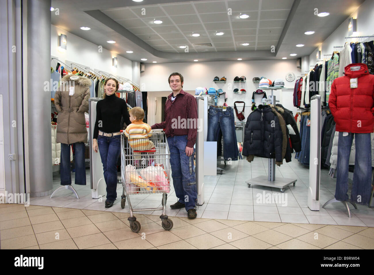 family in clothes shop Stock Photo - Alamy