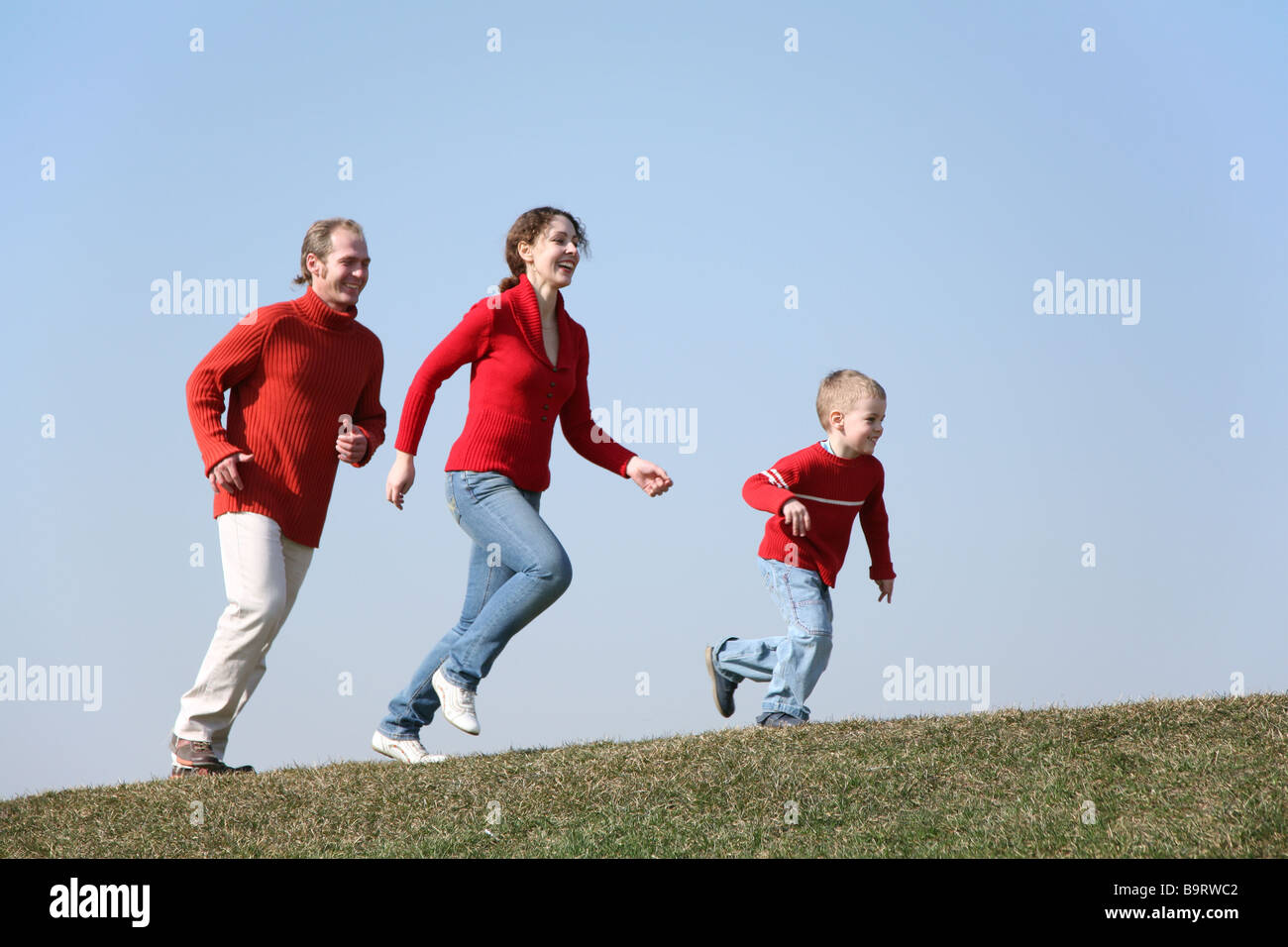 running family with son Stock Photo - Alamy