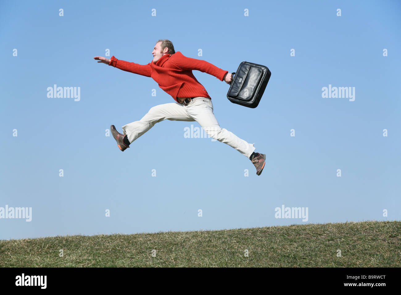 run fly man with bag Stock Photo - Alamy