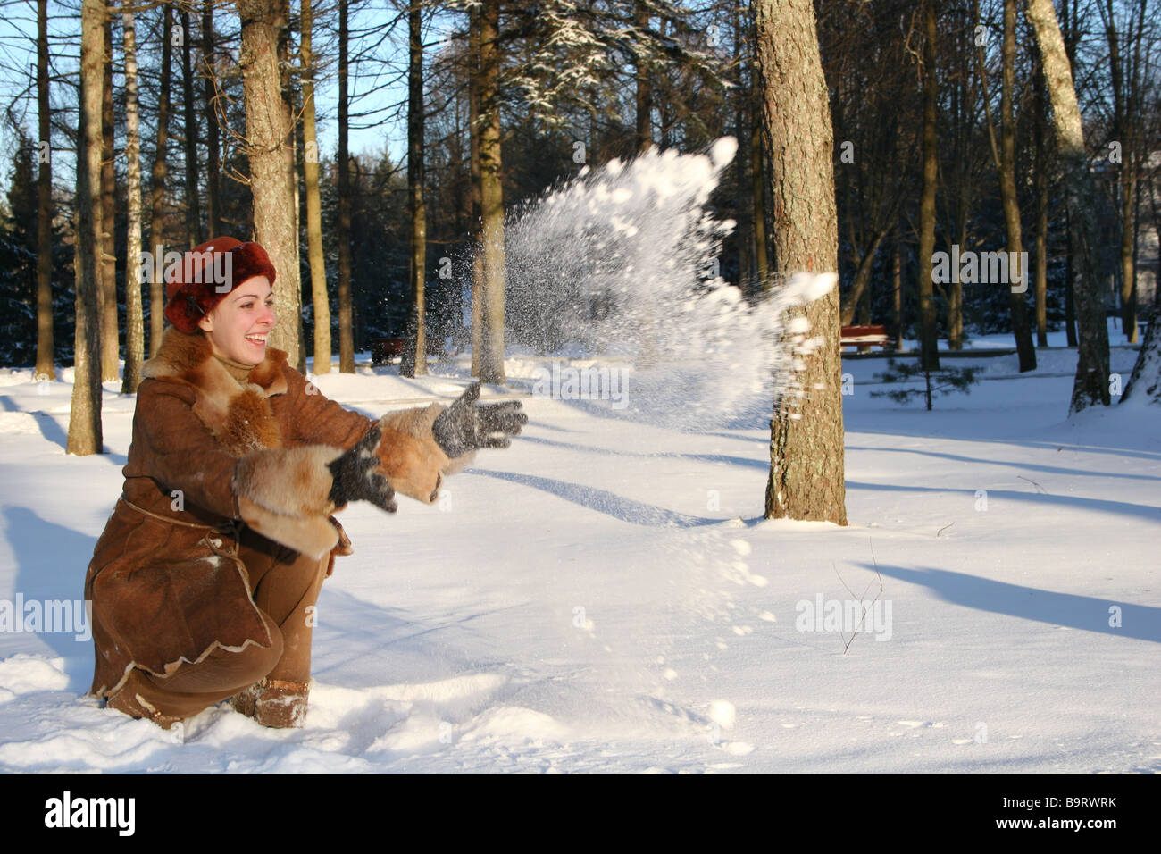 girl throw snow Stock Photo - Alamy