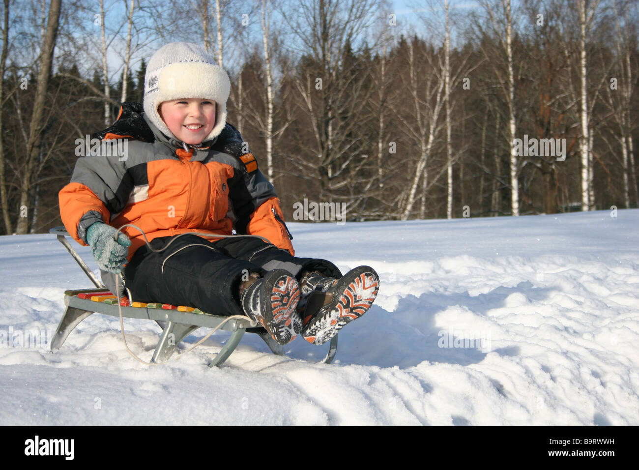 boy on sled Stock Photo - Alamy