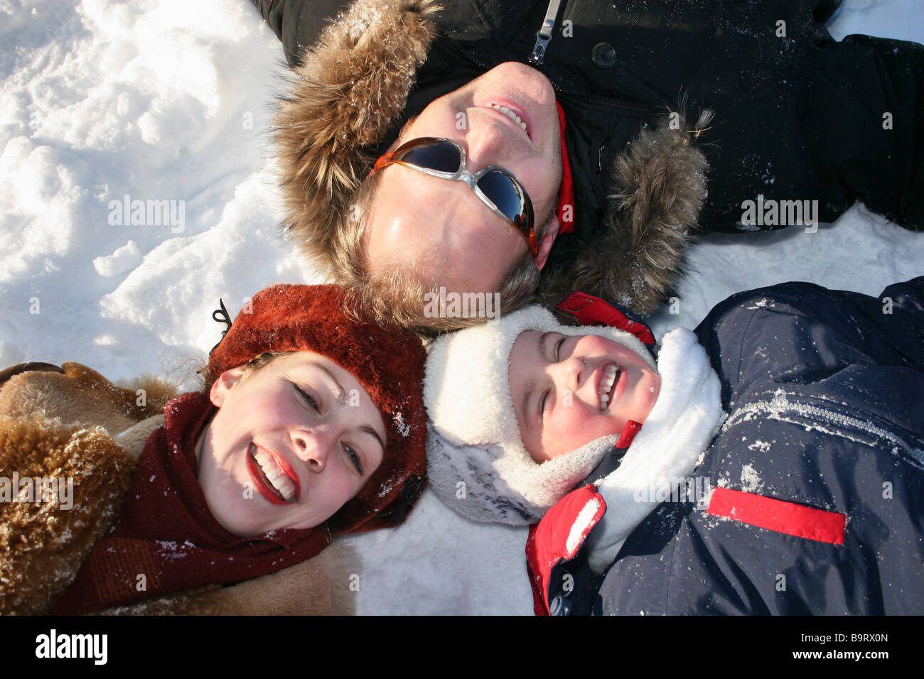 Happy boy lies on snow hi-res stock photography and images - Alamy